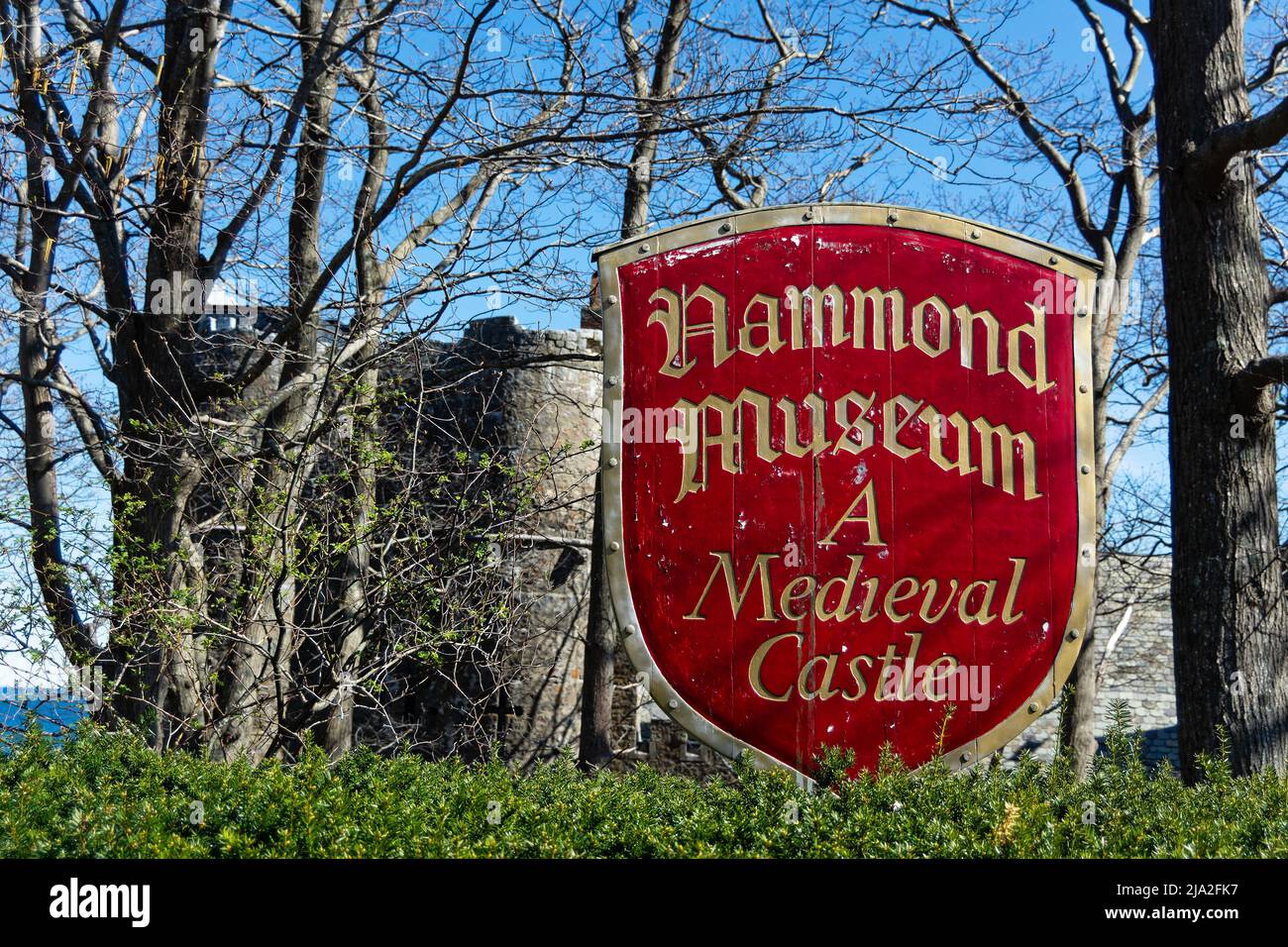 The sign for Hammond Castle Museum with the castle in the background ...