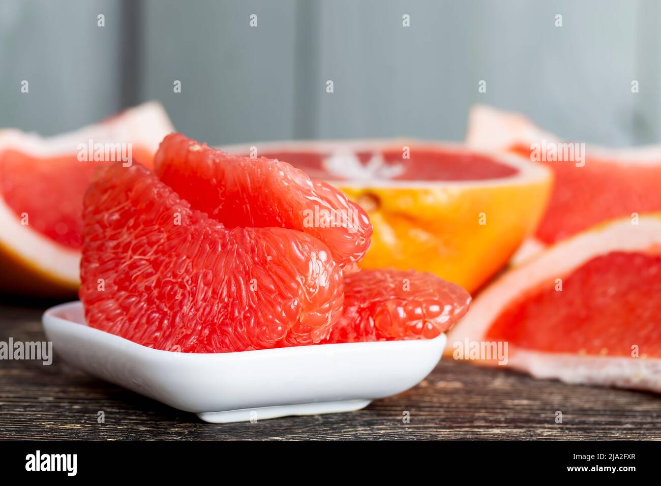 peeled and divided into parts ripe red grapefruit, grapefruit with ...