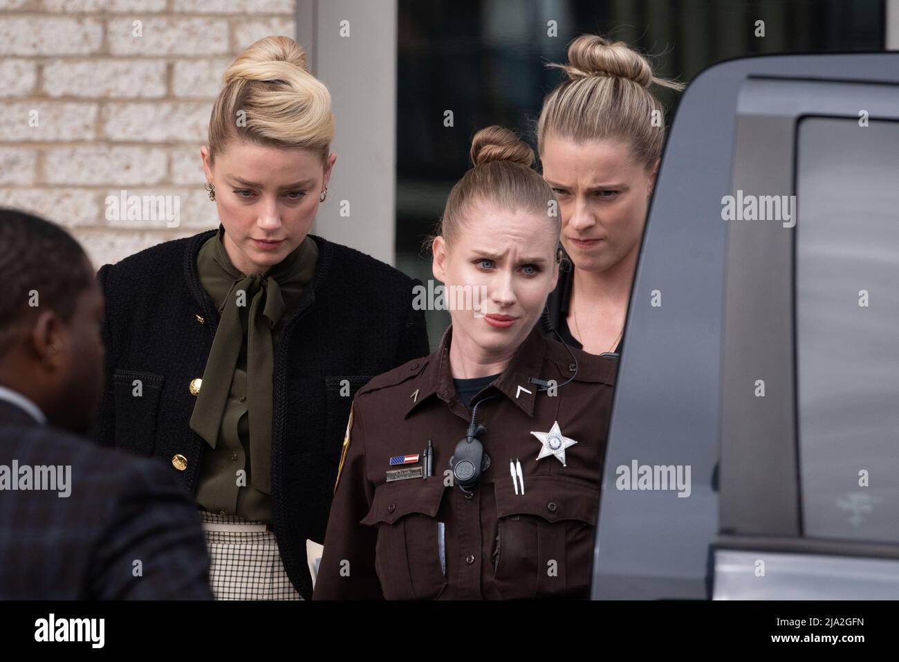Amber Heard, left, and her sister Whitney Heard, depart the Fairfax ...