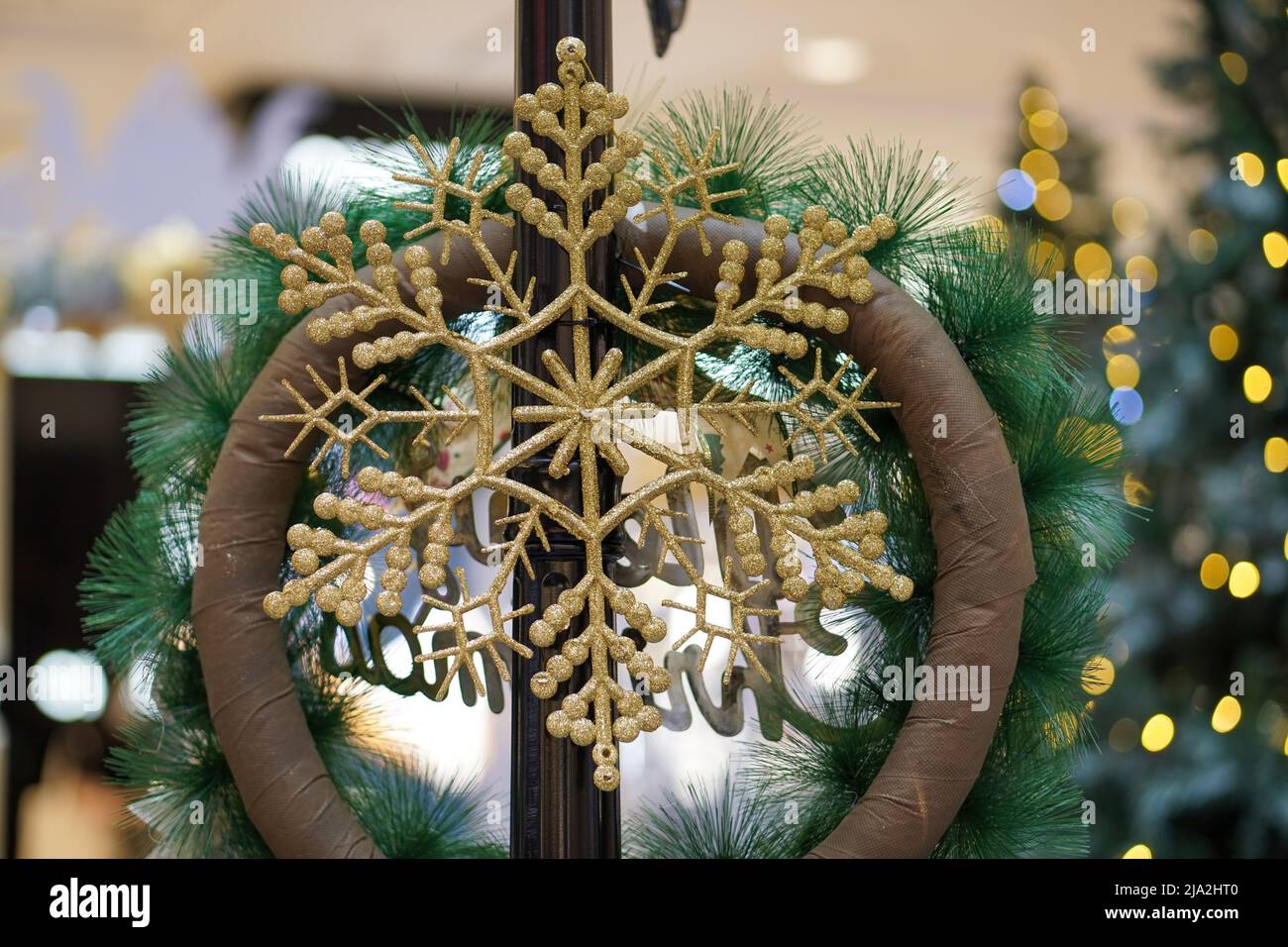 Gold color snowflakes display Stock Photo - Alamy