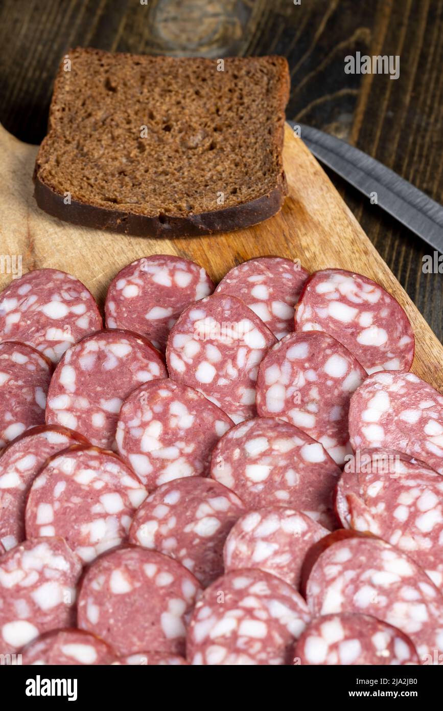 sliced pork sausage with the addition of lard, boiled pork meat with ...
