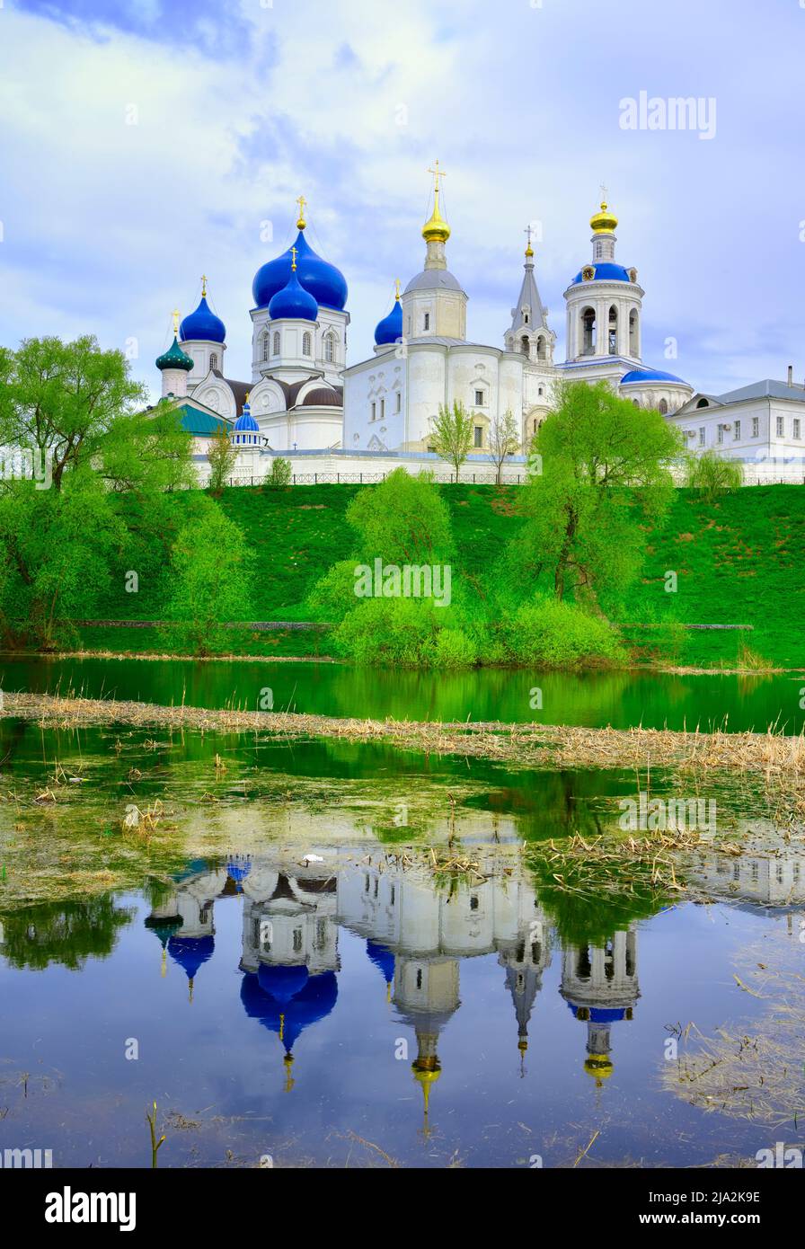 Domes of the Bogolyubov Monastery. The monastery pond in spring, the ...