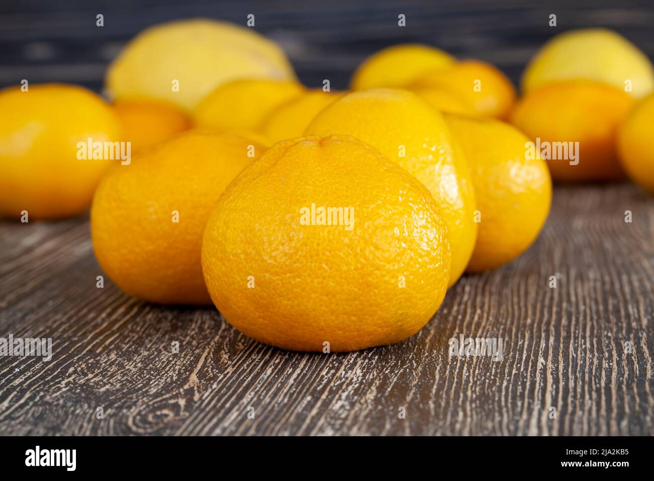 a bunch of citrus tangerines and other fruits together, a large number ...