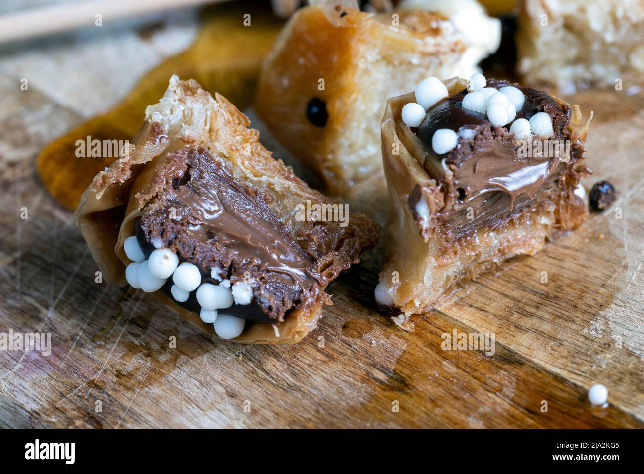 sweets made of thin puff pastry with chocolate filling and honey ...
