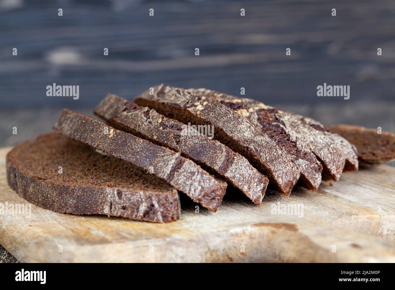sliced black rye bread, a loaf of sliced fresh rye bread Stock Photo ...
