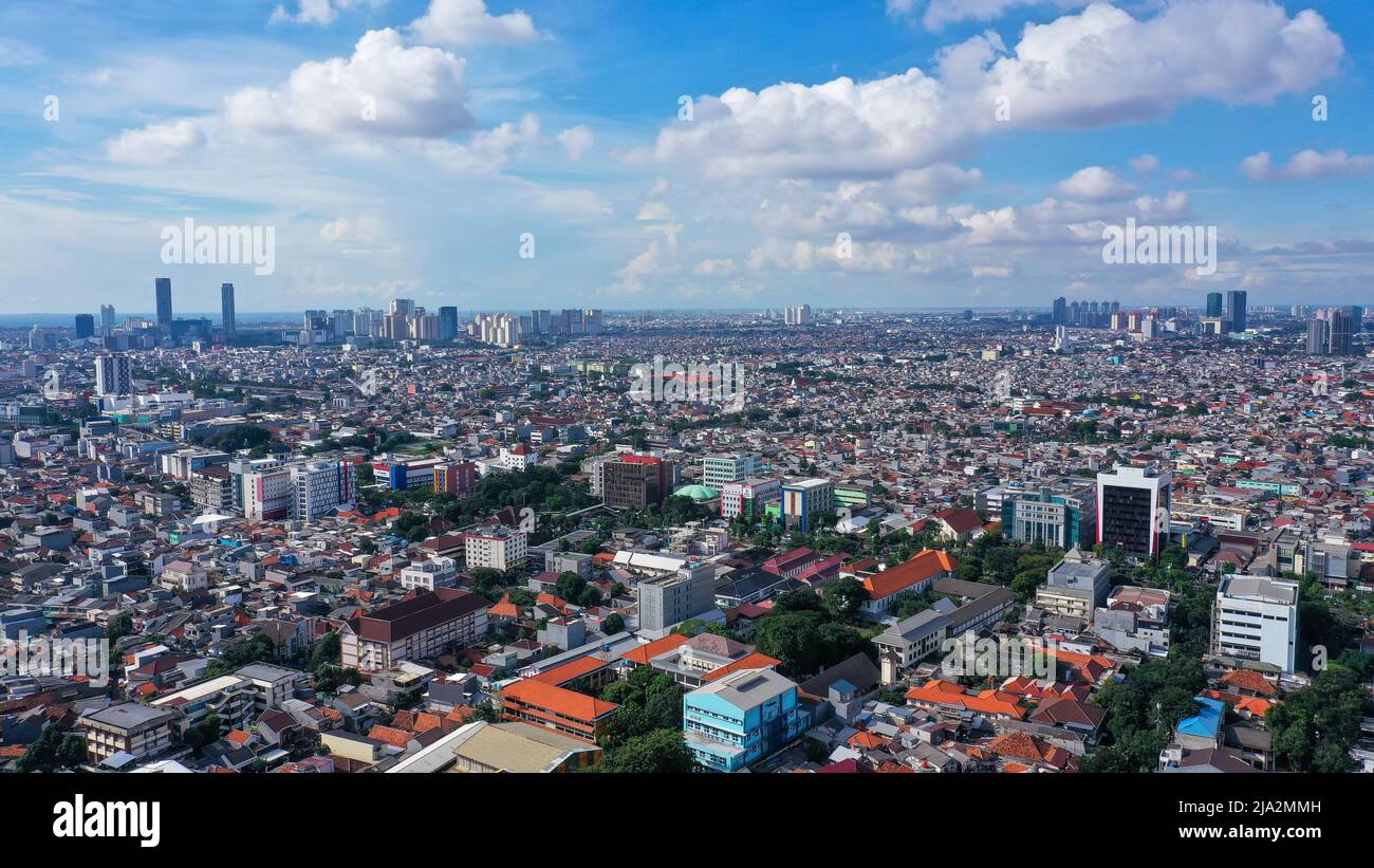 Aerial view of beautiful Jakarta downtown under blue sky at morning ...