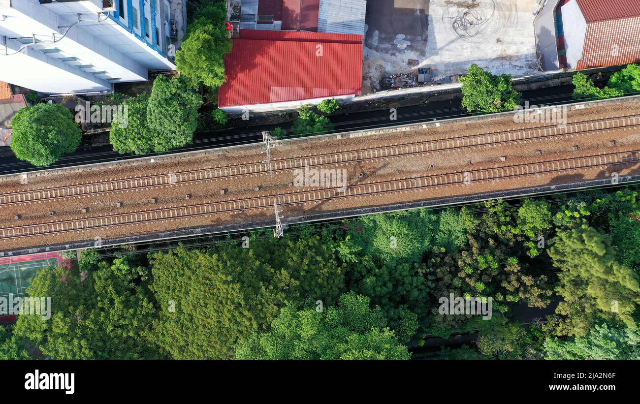 Top down view of Jakarta LRT train tracks over road intersection Stock ...