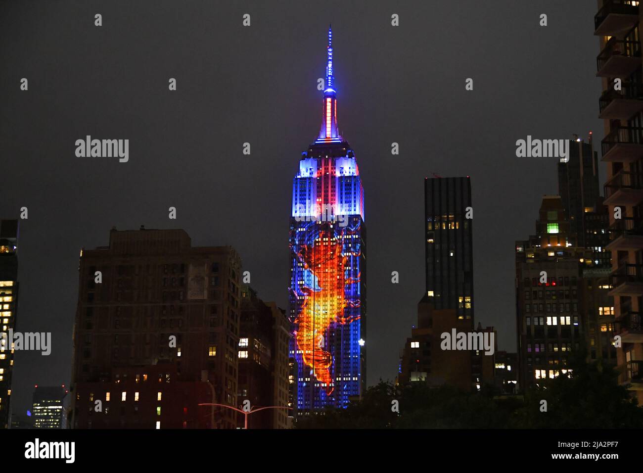 Scenes from the television show 'Stranger Things' are projected on the ...