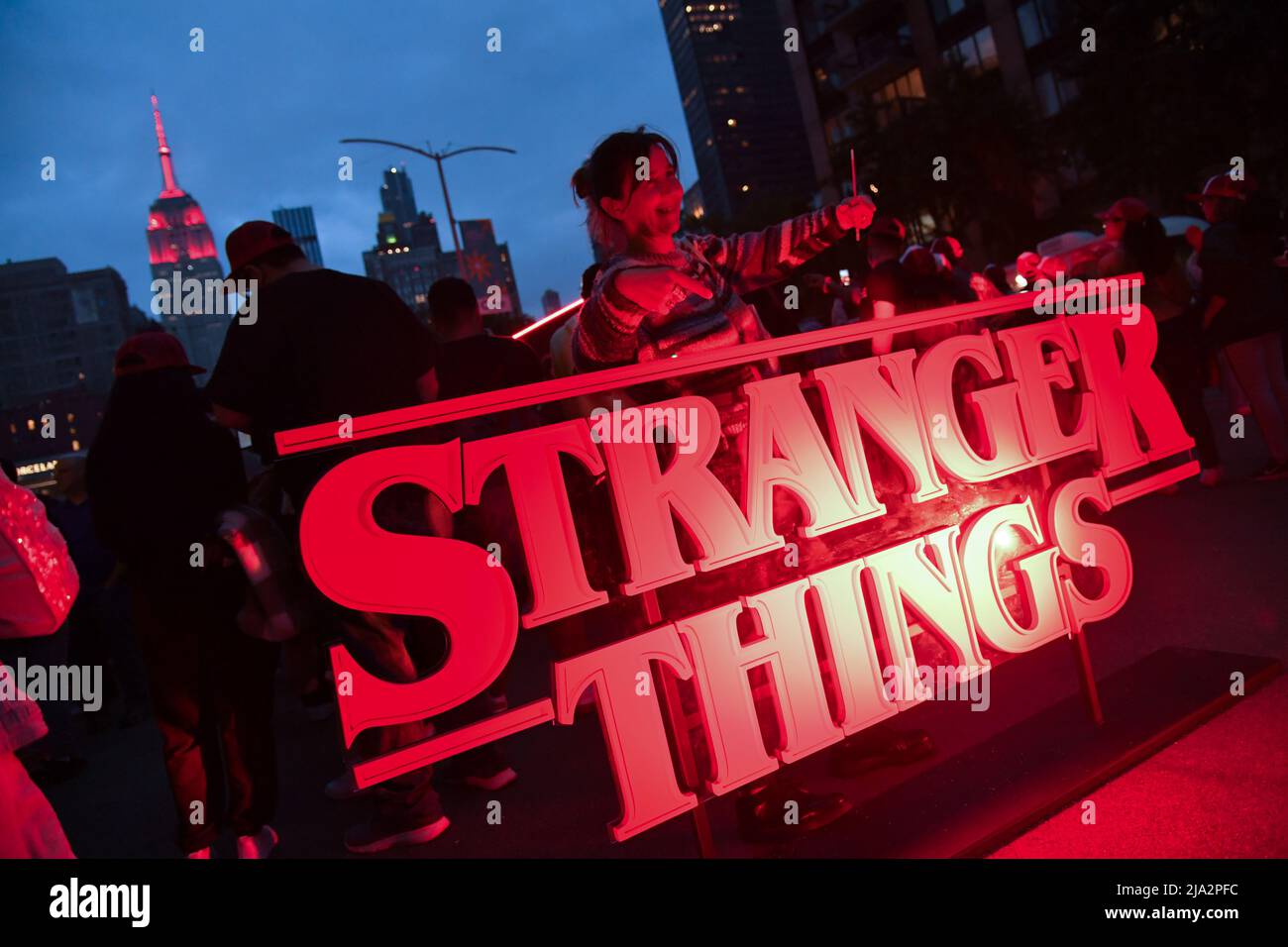 Scenes from the television show 'Stranger Things' are projected on the ...