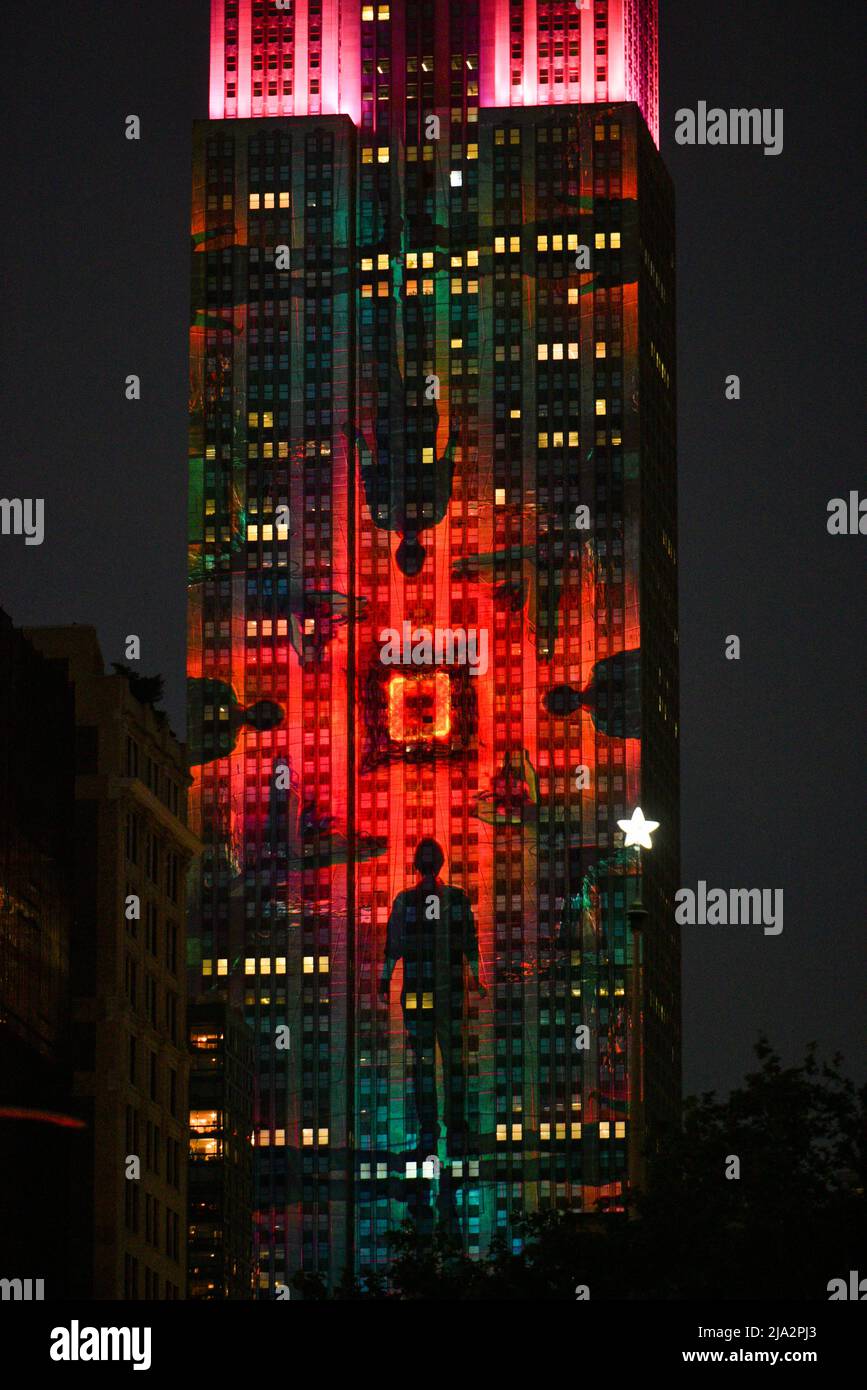 Scenes from the television show 'Stranger Things' are projected on the ...