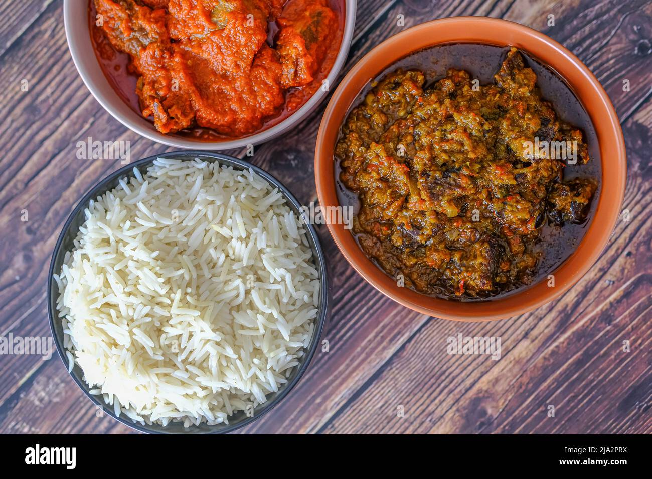 Nigerian chicken tomato stew with rice hi-res stock photography and ...