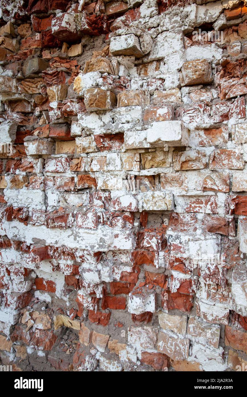 an old crumbling wall of a building, a part of the wall of a building ...