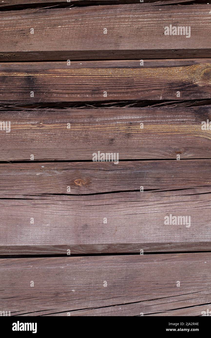 an old wooden surface with a number of damages, an old surface made of ...