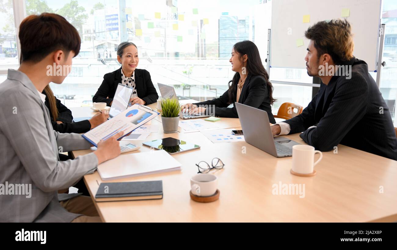 Company business meeting image, A group of Asian businesspeople having ...