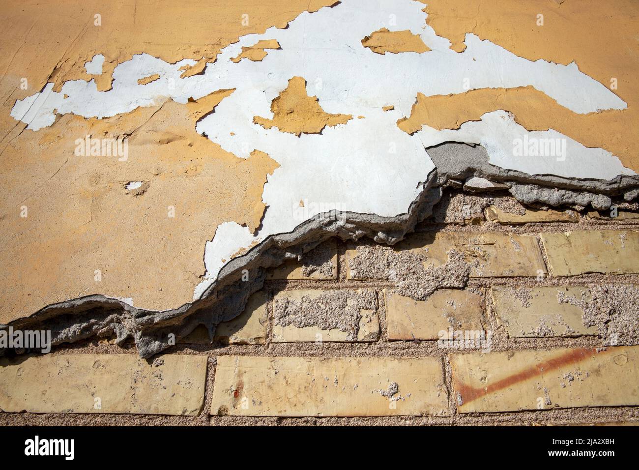 an old crumbling wall of a building, a part of the wall of a building ...