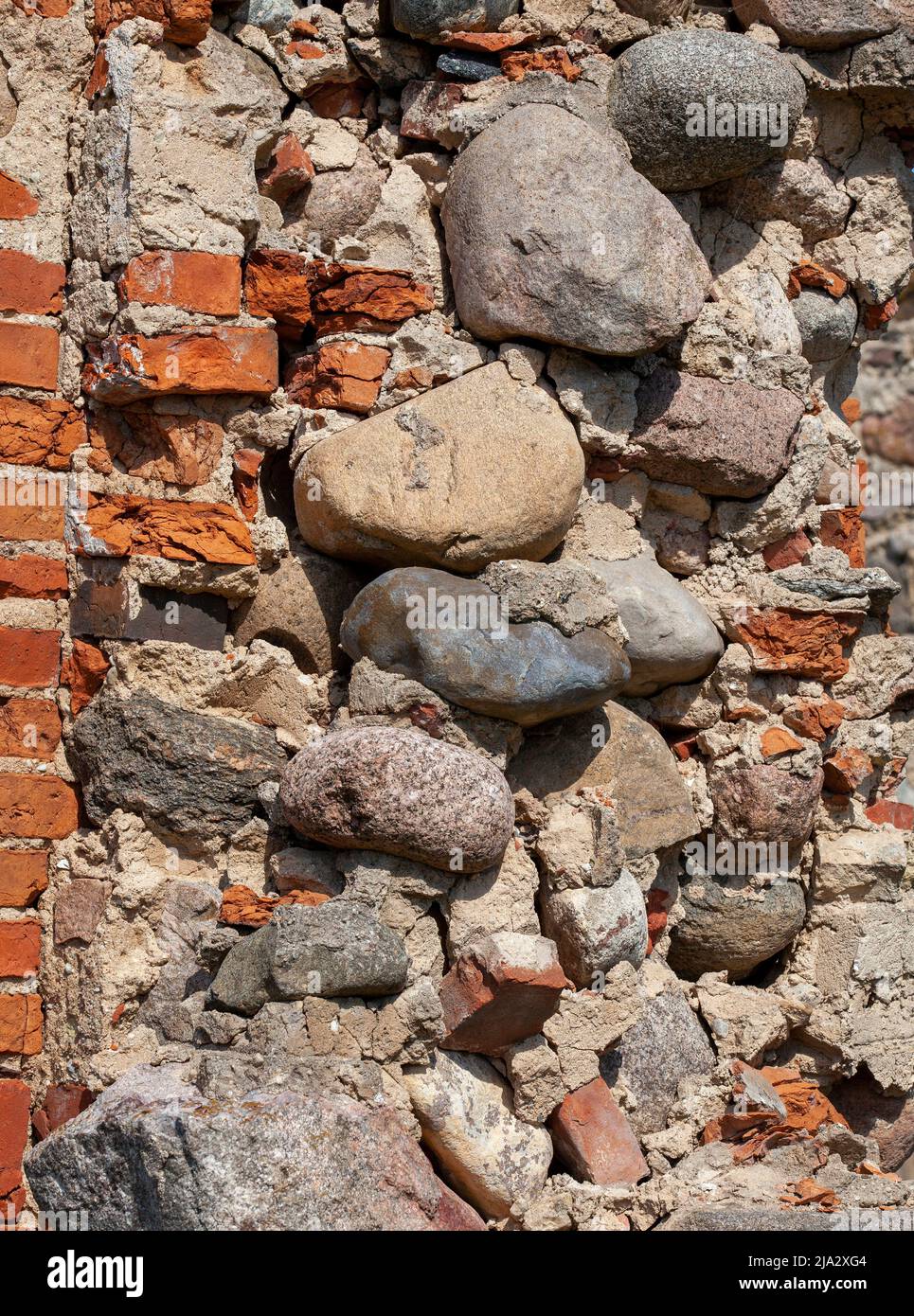 an old crumbling wall of a building, a part of the wall of a building ...