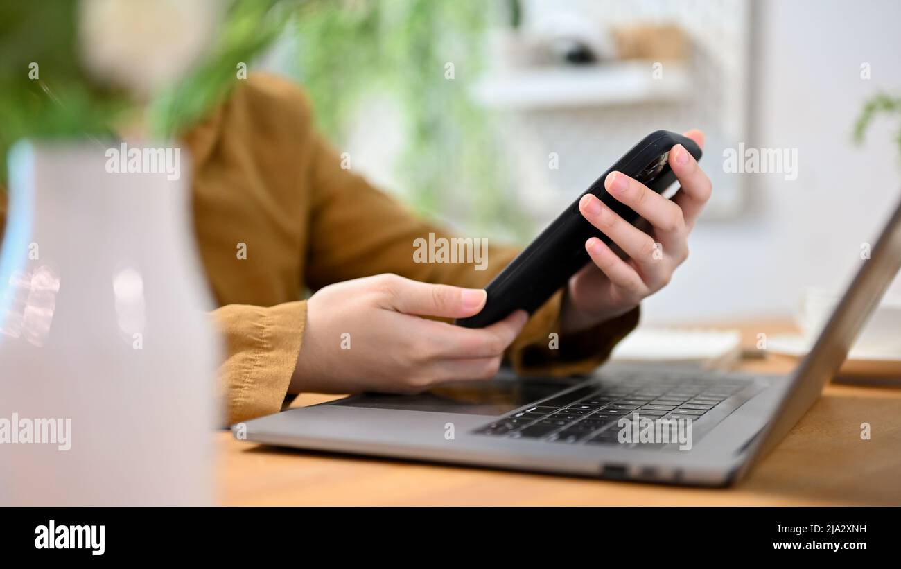 Close-up image, Female hands holding a smartphone, using cellphone ...