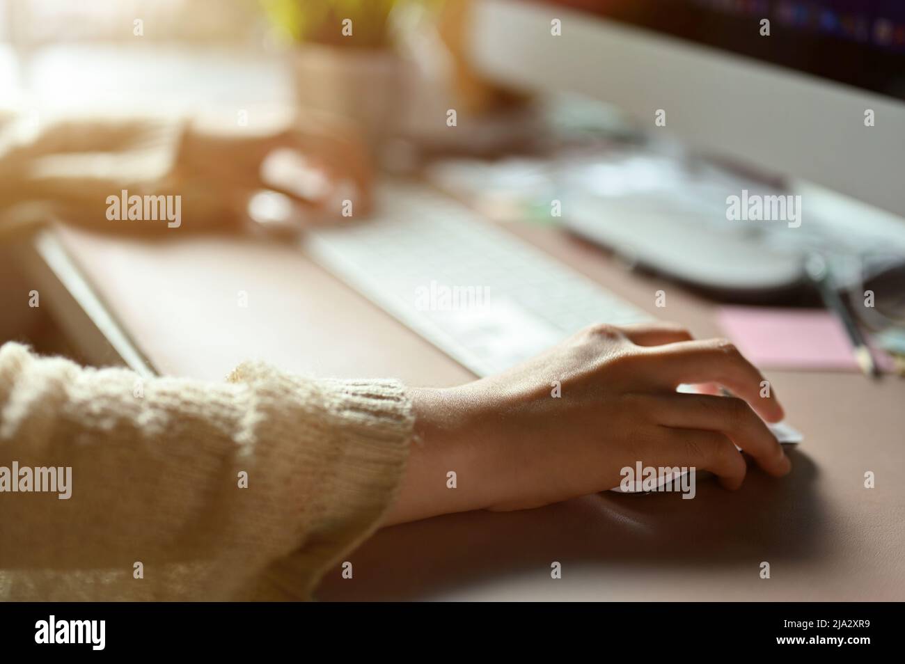 Female office worker or business employee sits at her office desk ...