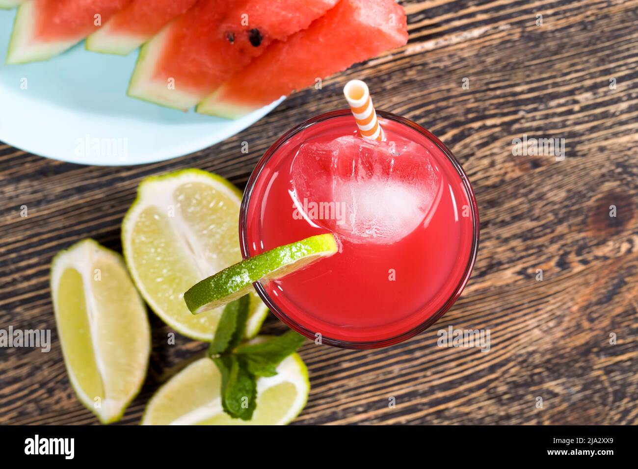 watermelon juice from ripe red and juicy watermelons and pieces of ice ...
