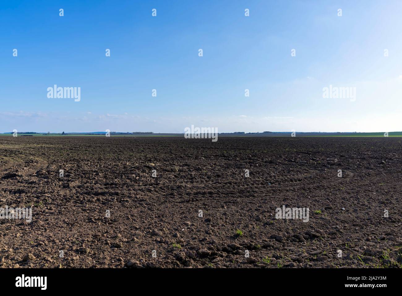soil in an agricultural field that is being prepared to receive a new ...