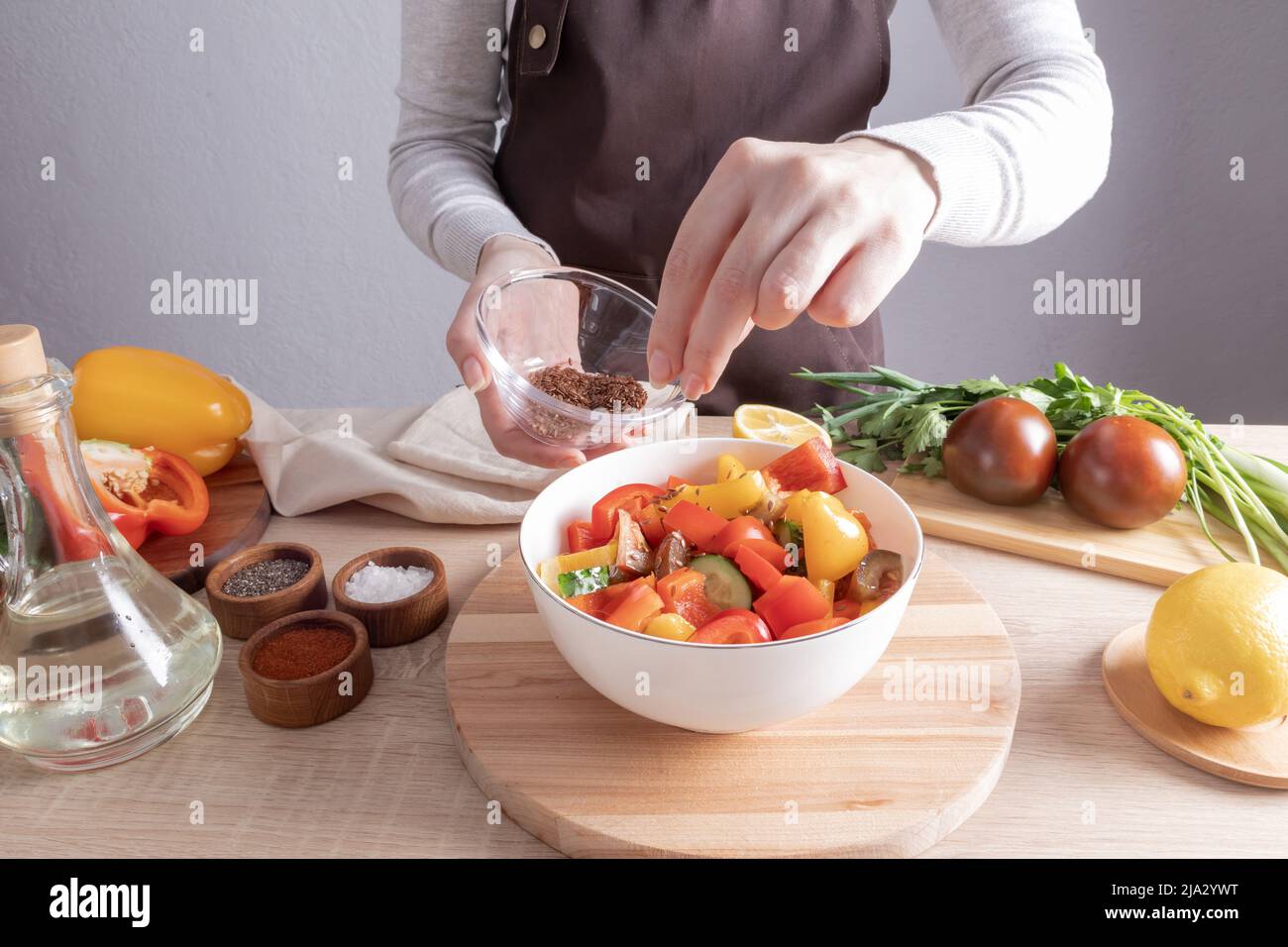 preparation of delicious and healthy food. the hands of a young girl ...