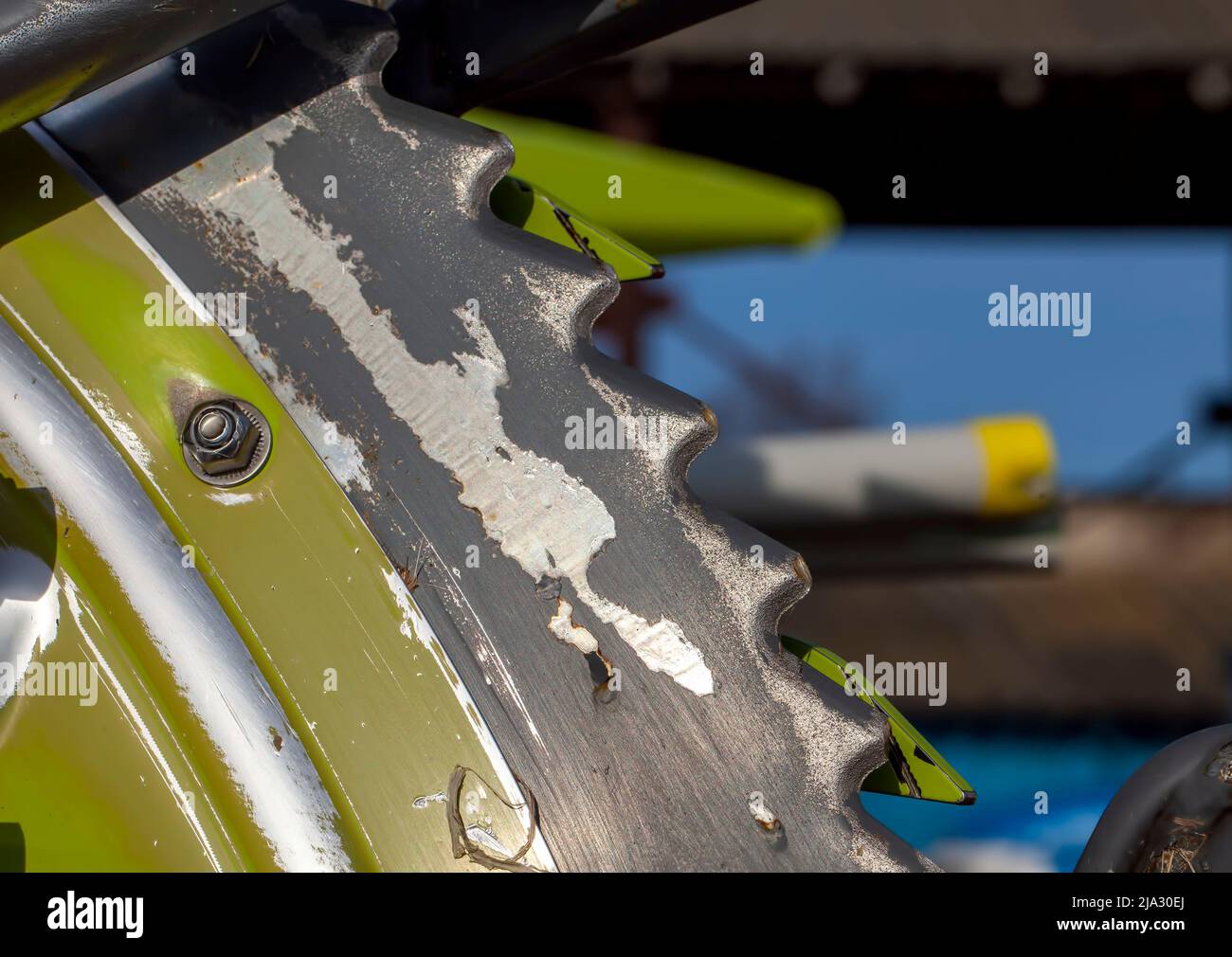 metal surface with paint worn off from work, part of the plow for ...