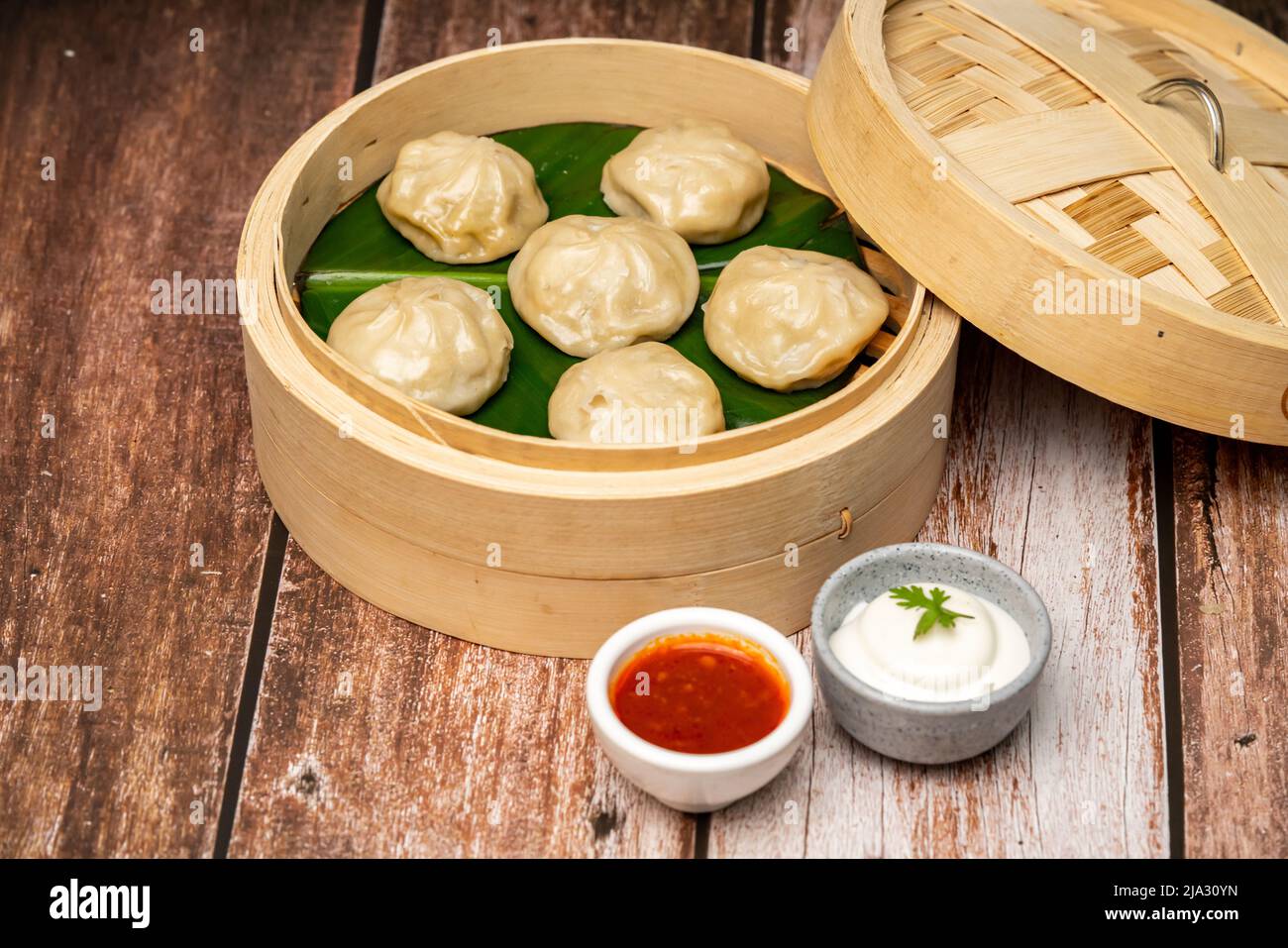 Chinese Steamed Momo with Chutney and Mayo Stock Photo - Alamy