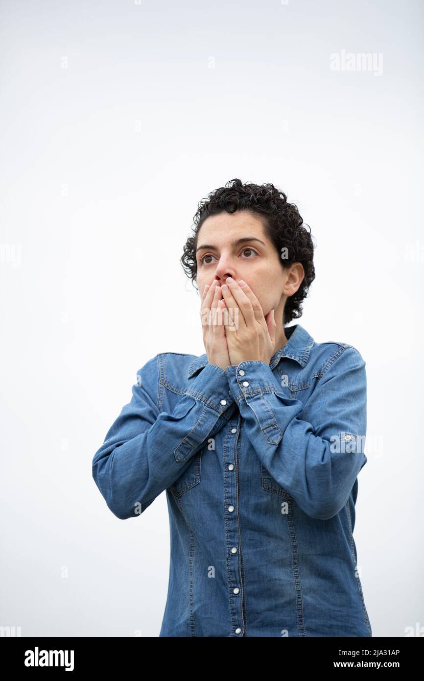 Scared woman hands covering mouth Stock Photo - Alamy