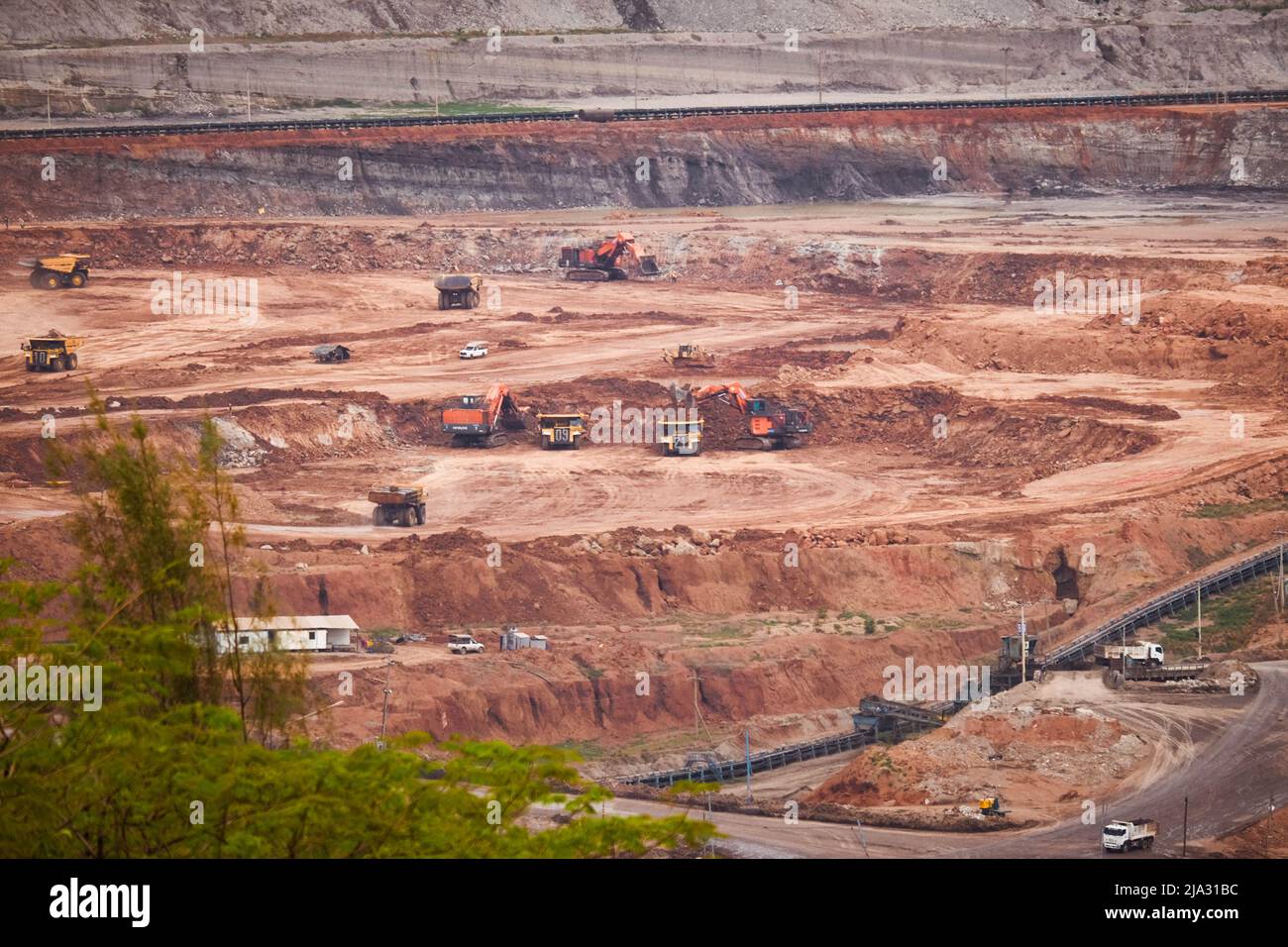 View of Trucks and excavators work in open pits in lignite coal mines ...