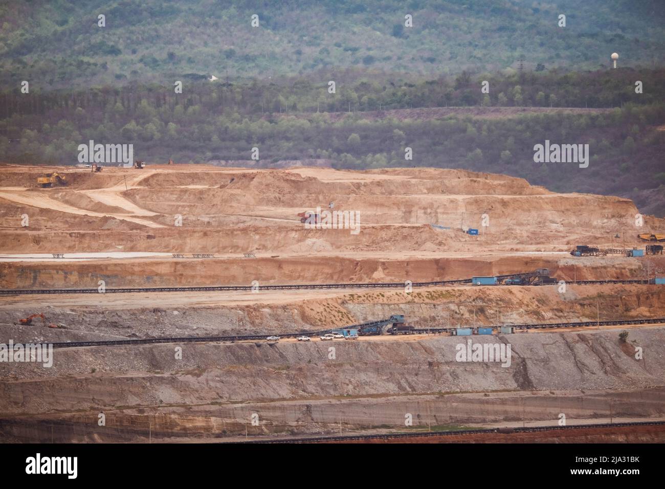View of Trucks and excavators work in open pits in lignite coal mines ...