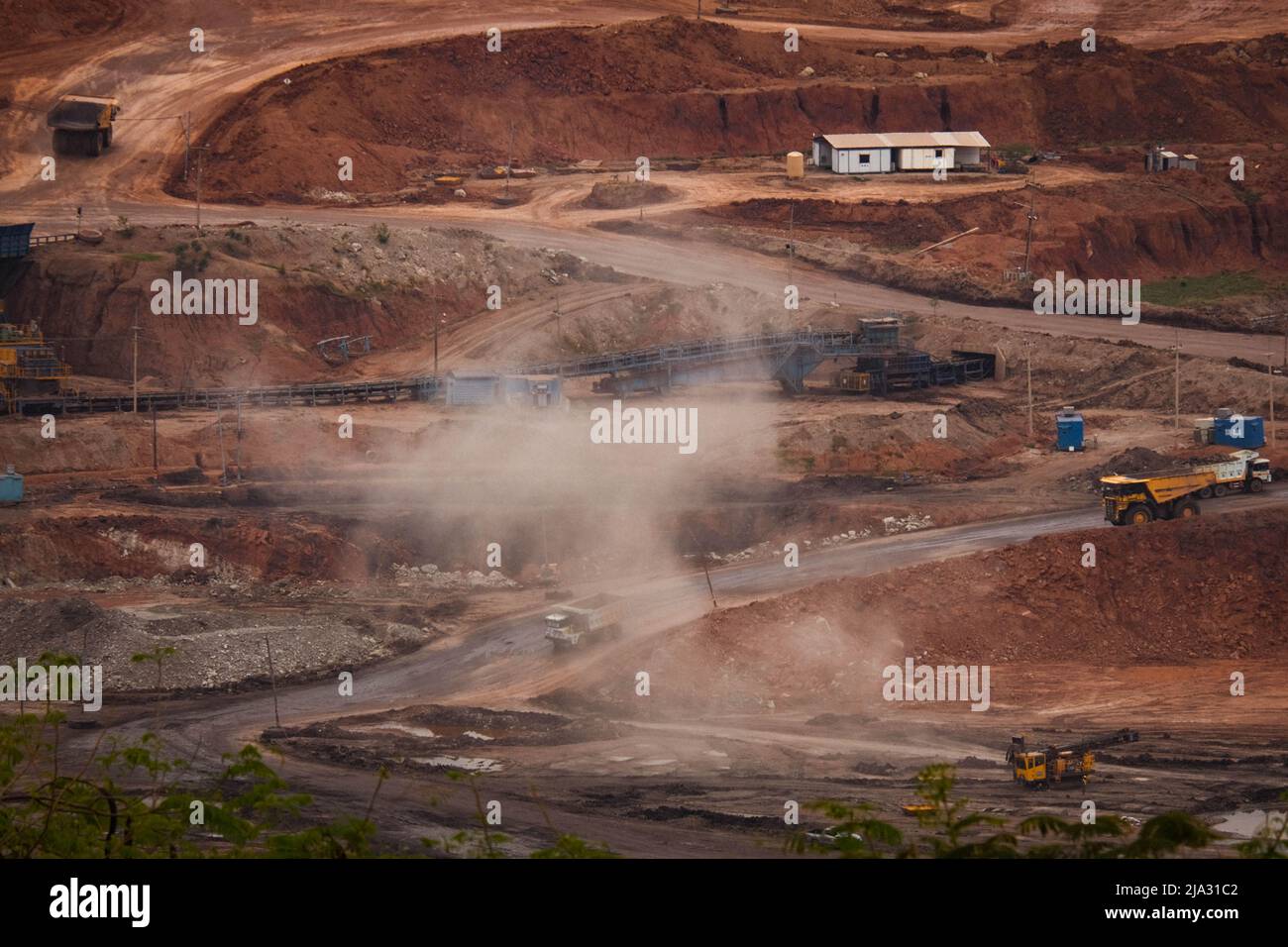 View of Trucks and excavators work in open pits in lignite coal mines ...