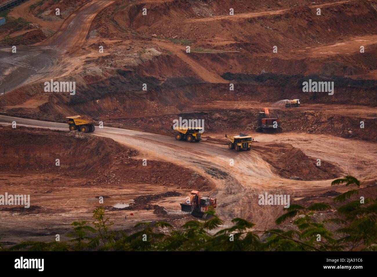 View of Trucks and excavators work in open pits in lignite coal mines ...