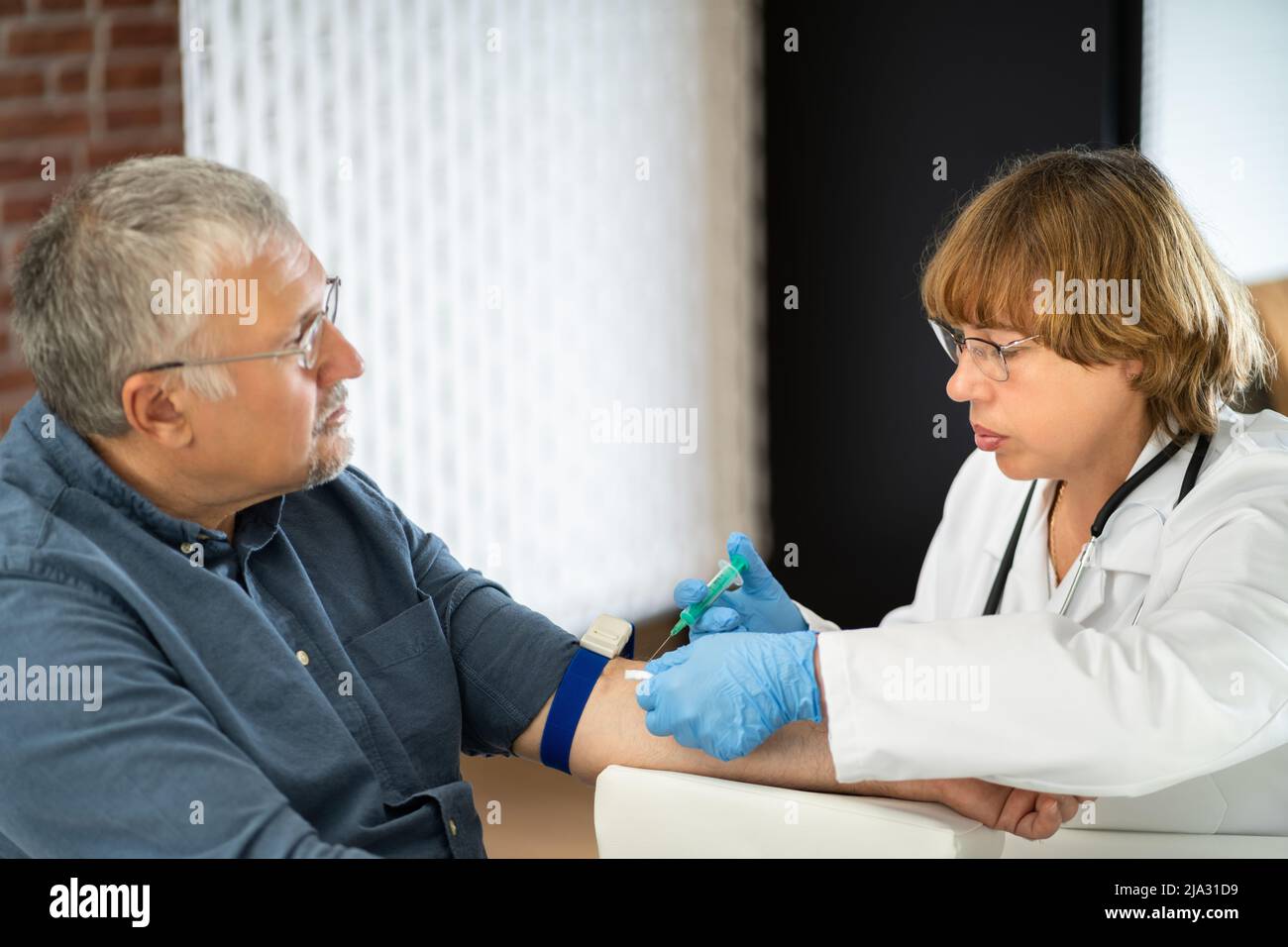 Close-up Of Doctor Taking Blood Sample From Patient's Arm Stock Photo ...