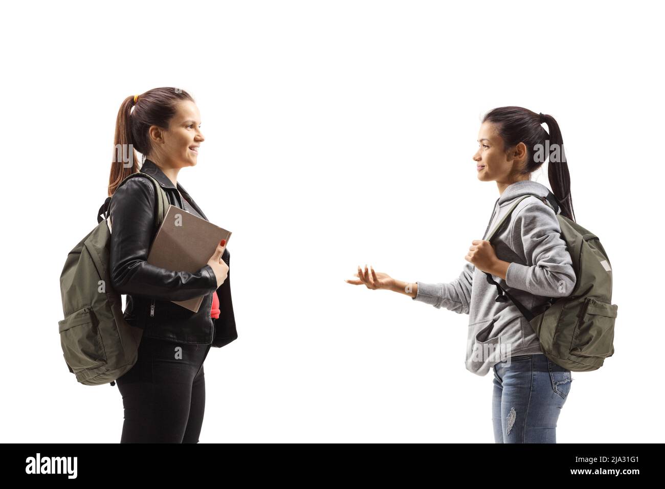 Female students having a conversation isolated on white background ...