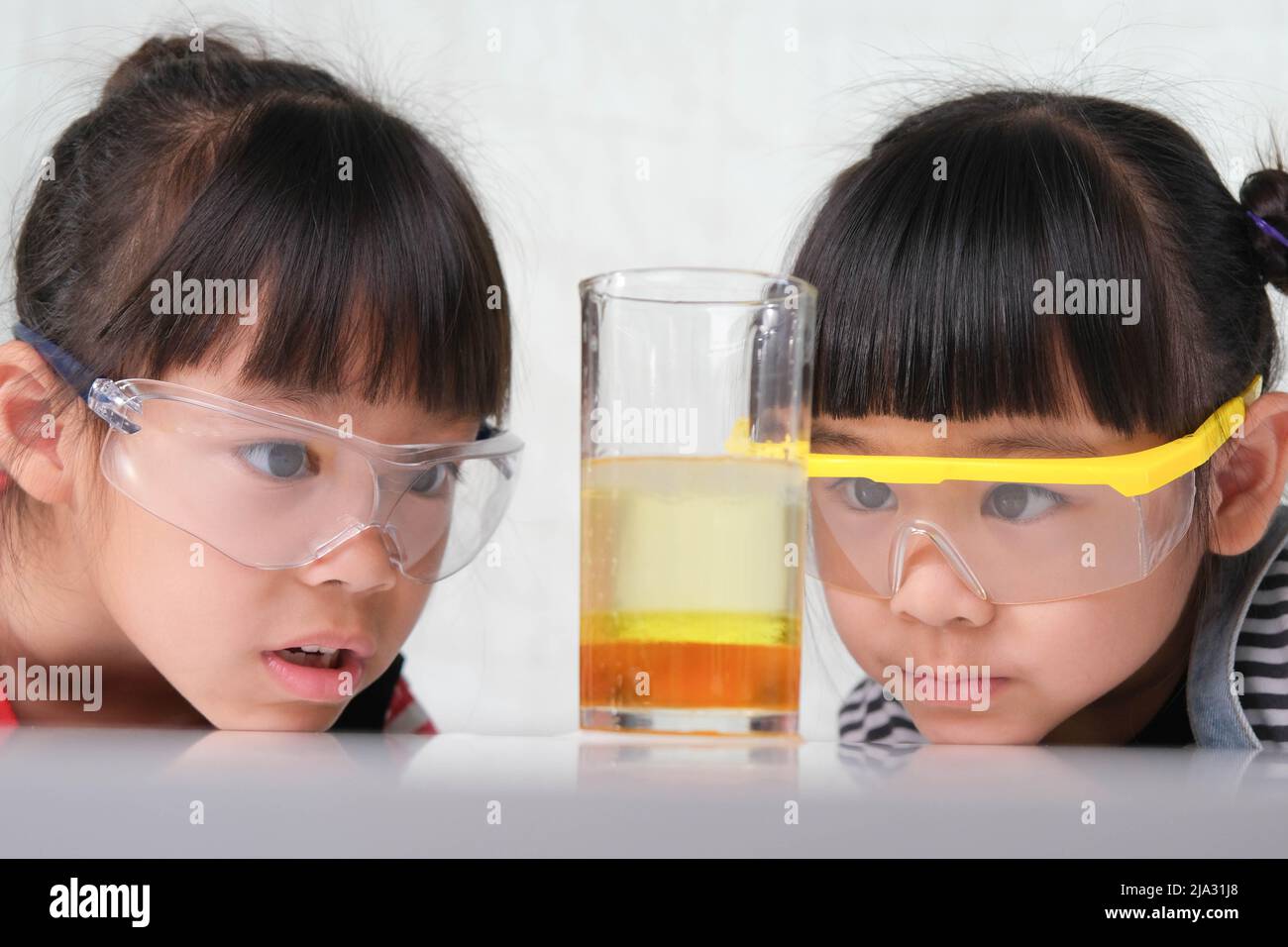 Children are learning and doing science experiments in the classroom ...