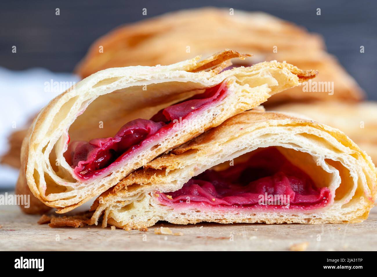 puff pastry with strawberry red filling, delicious bun dessert with ...