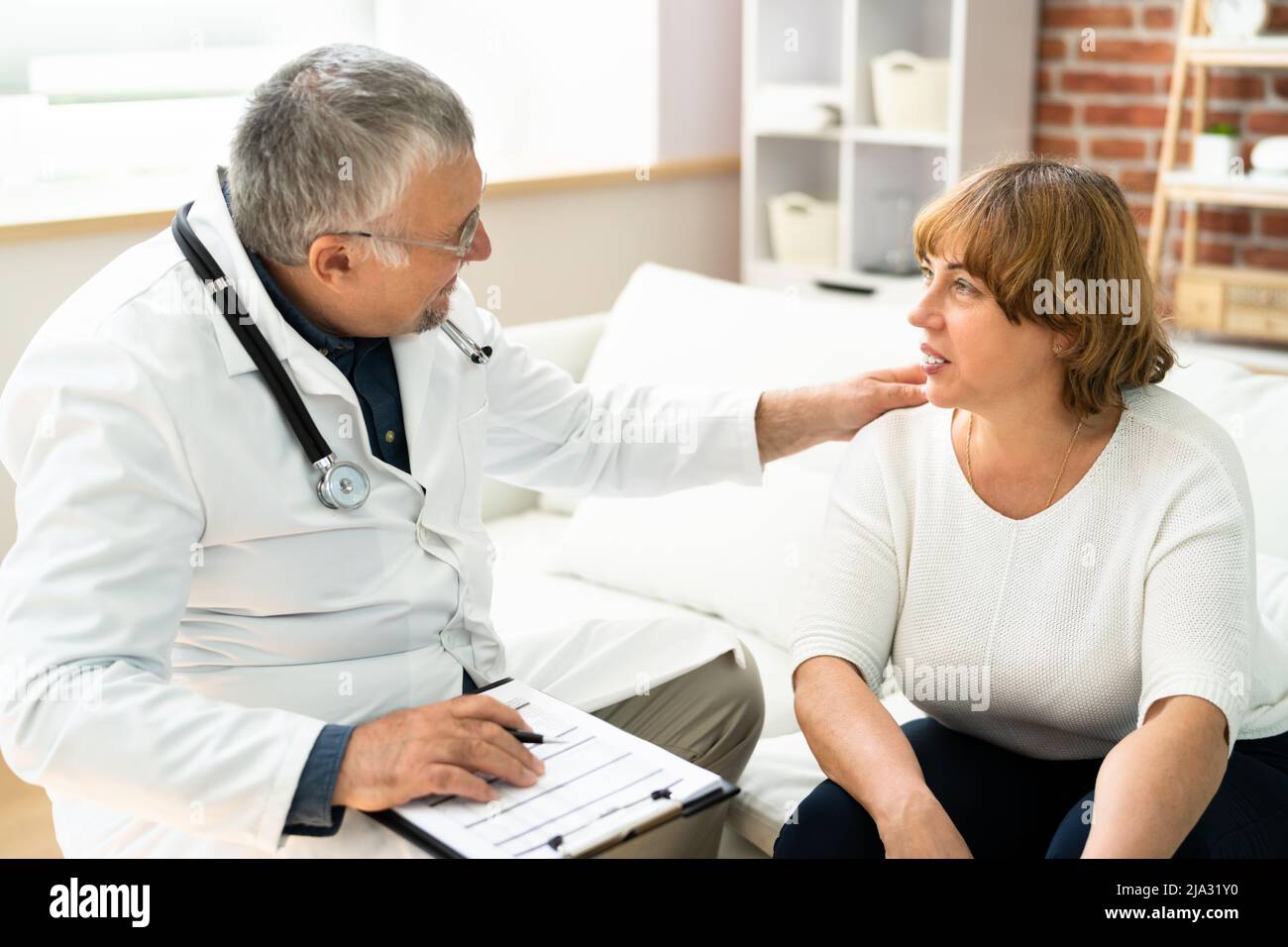 Doctor Talking With Elderly Patient. Elder Healthcare Stock Photo - Alamy