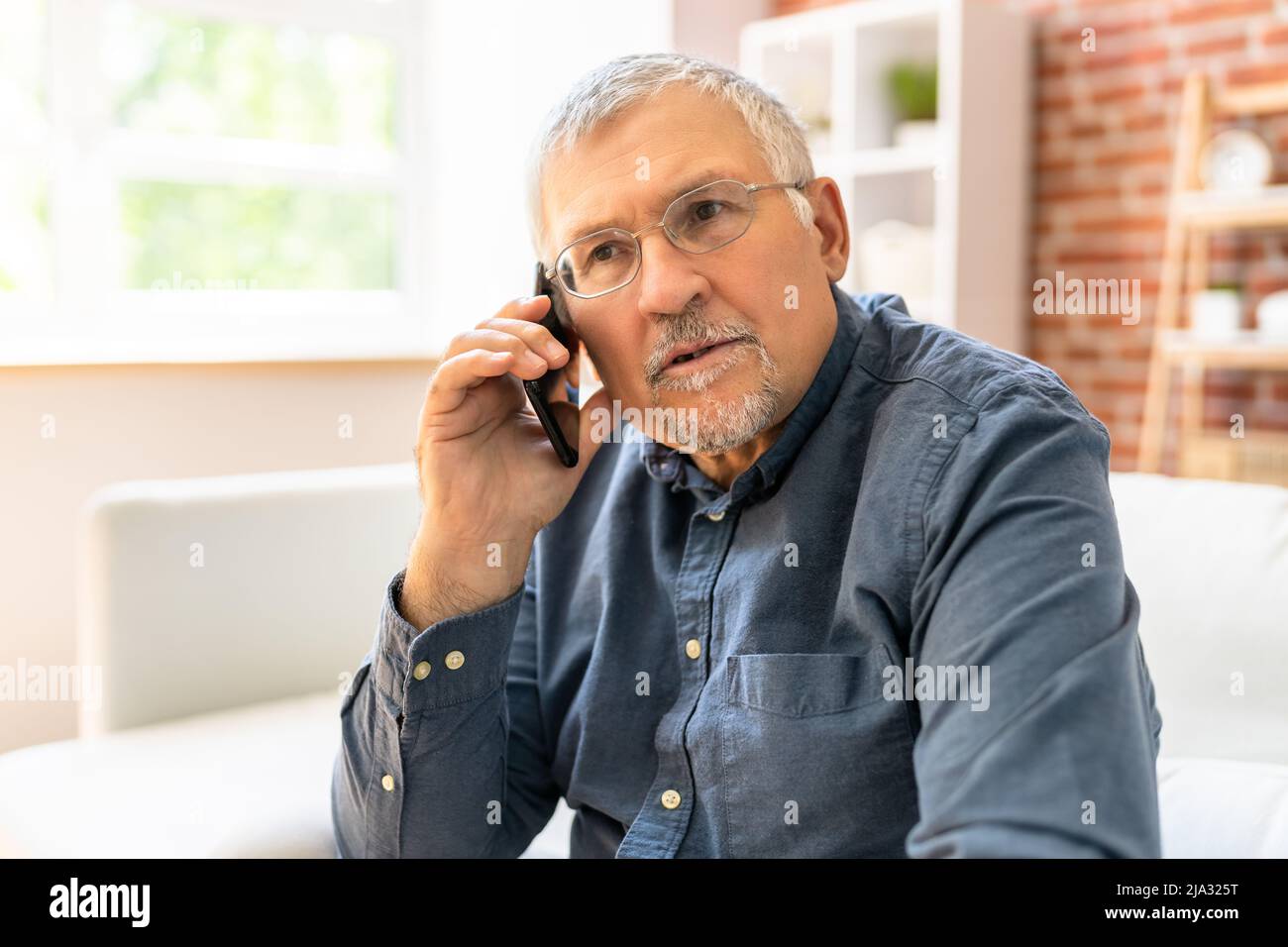 Landline phone senior hi-res stock photography and images - Alamy