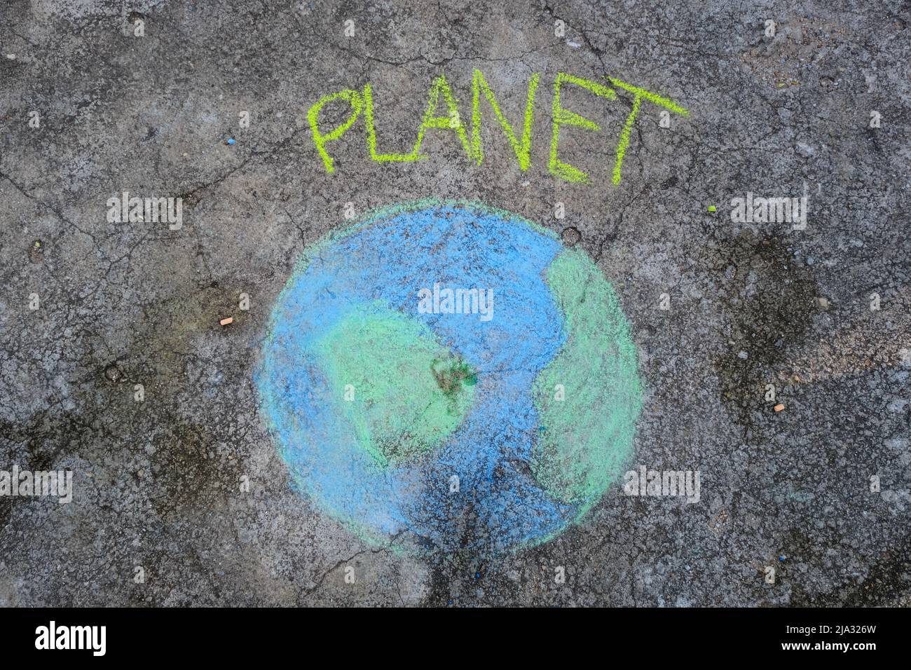 Beautiful world drawing with chalk with Planet text on asphalt ...