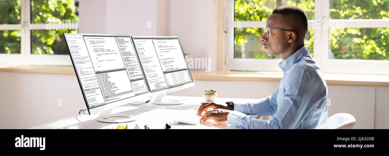 African American Coder Using Computer At Desk. Web Developer Stock ...