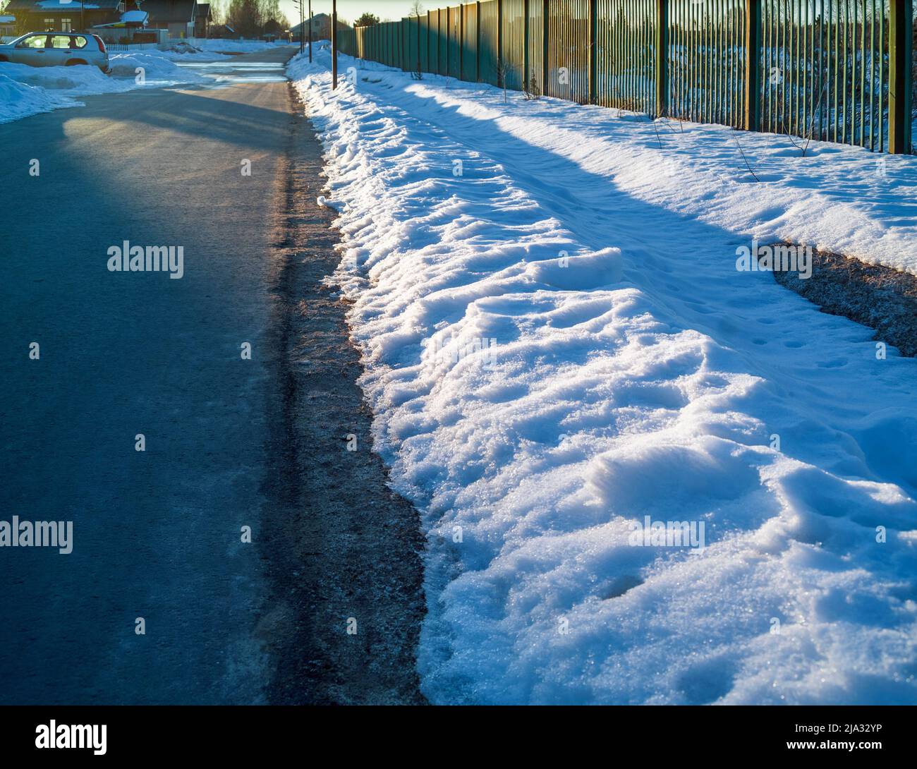 a street with removed snow, winter scene, no people Stock Photo - Alamy