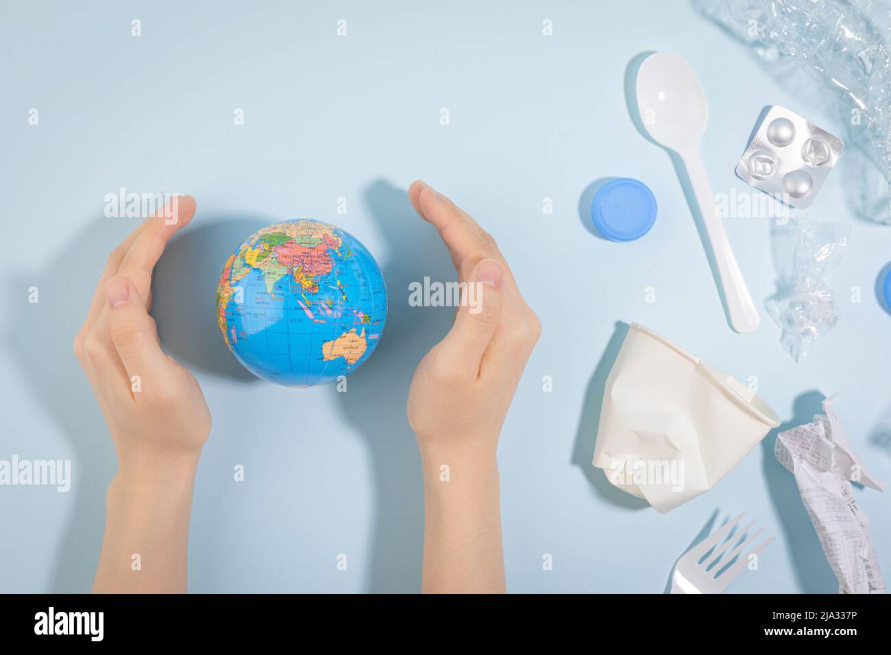 protect earth and environment concept, globe and plastic paper ...