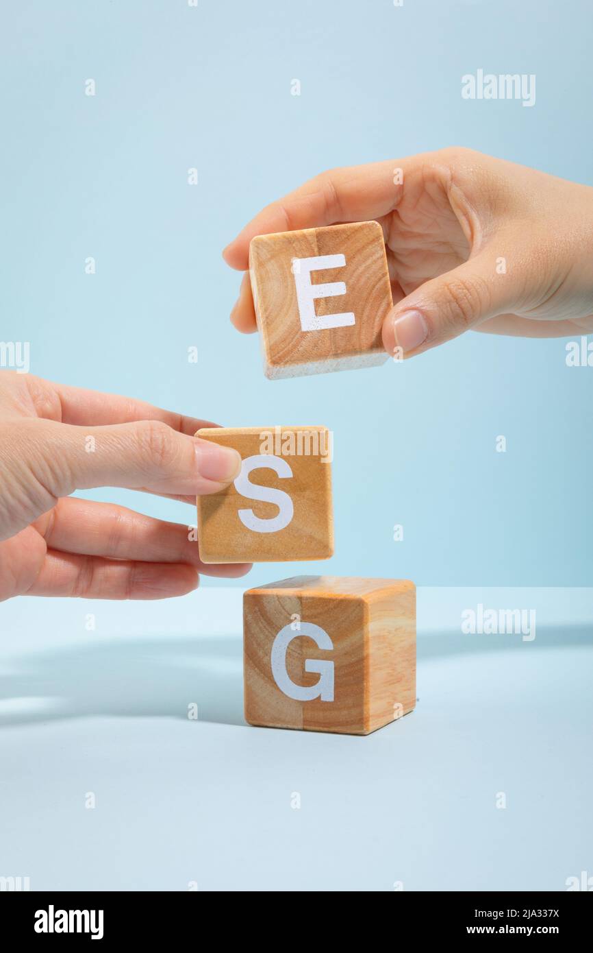 protect earth and environment concept, esg wooden box and hand Stock ...