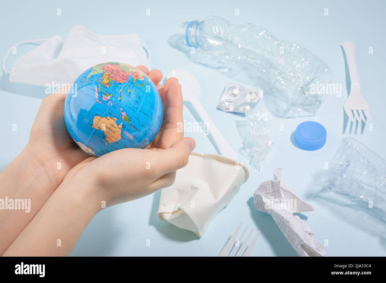 protect earth and environment concept, globe and plastic paper ...