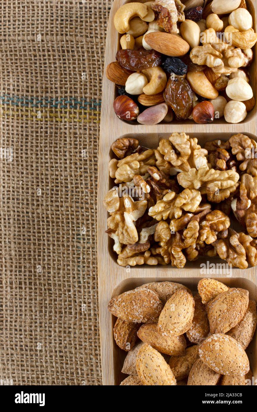 mixed nuts in a bamboo plate Stock Photo - Alamy
