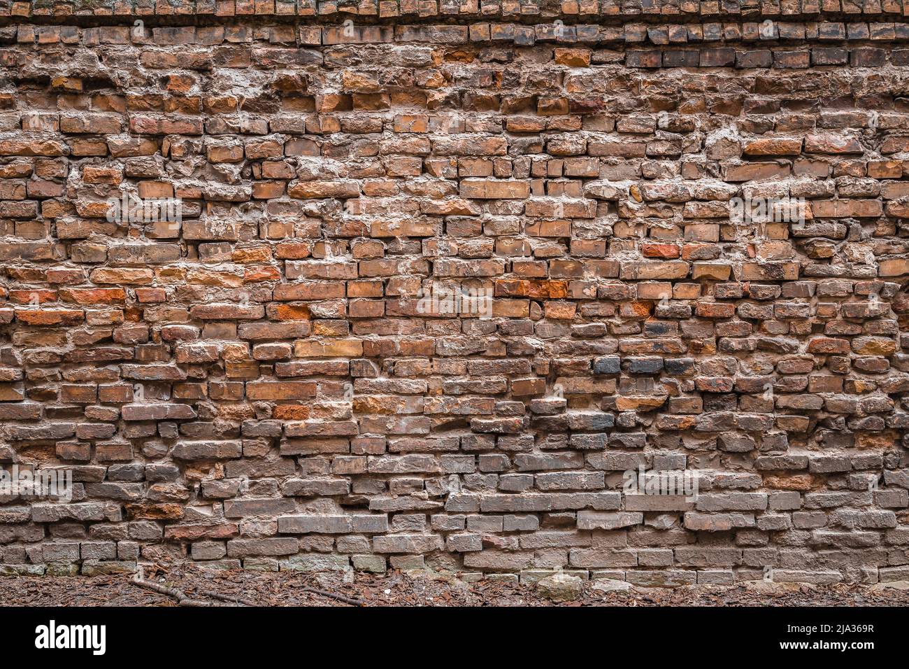Old messy brick wall texture background exterior Stock Photo - Alamy