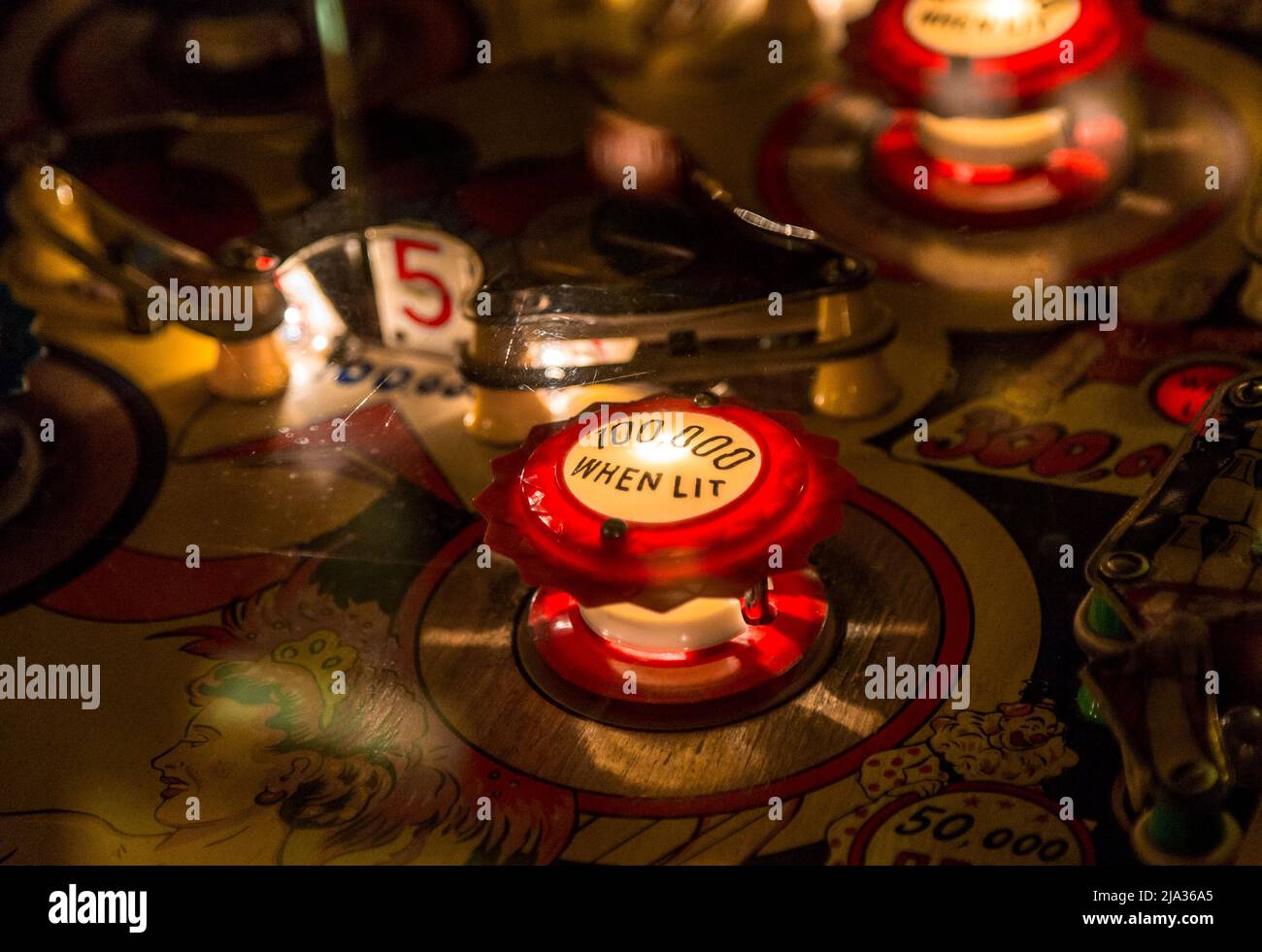 Pinball table close up view of vintage game machine Stock Photo - Alamy