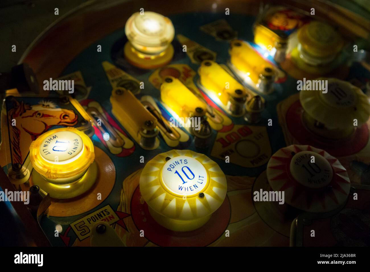 Pinball table close up view of vintage game machine Stock Photo - Alamy