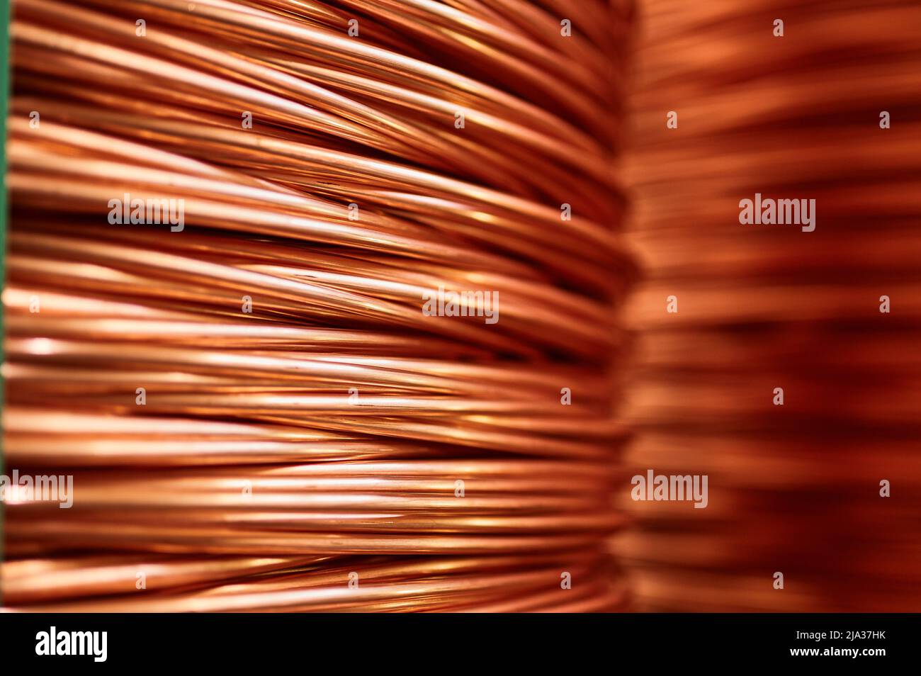 Large bobbin of orange copper wire in light warehouse Stock Photo - Alamy