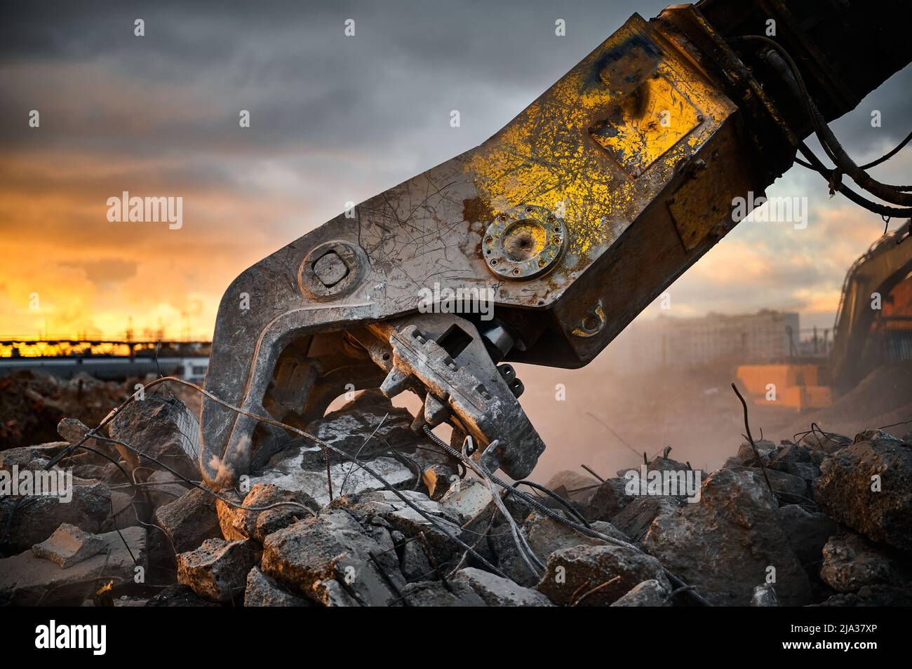 Metal crusher on excavator rigging destroys armored concrete Stock ...